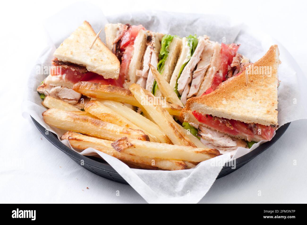 clubhouse sandwich with crispy fries Stock Photo - Alamy