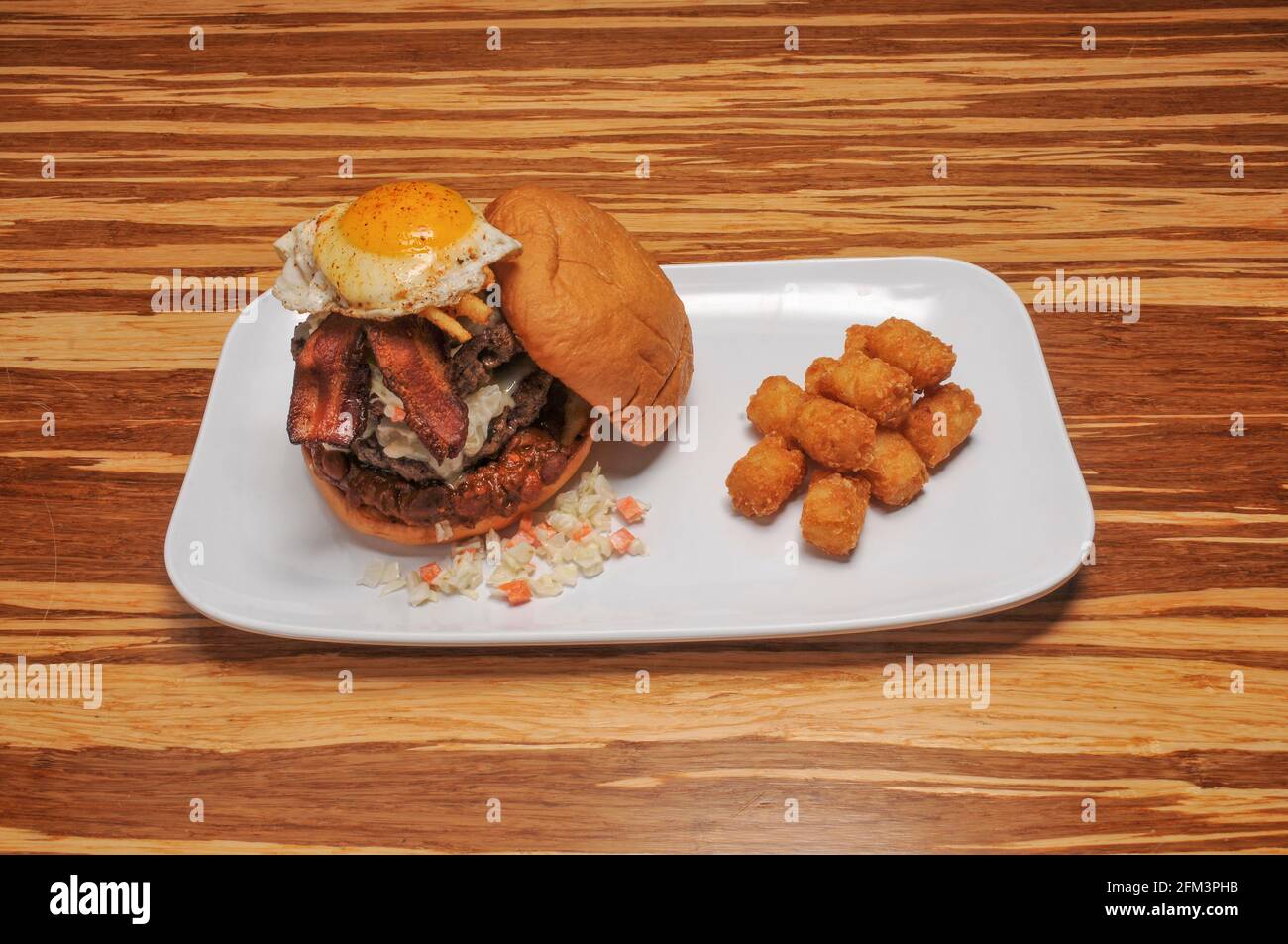 All American classic bacon and egg cheeseburger on a sesame seed bun ...