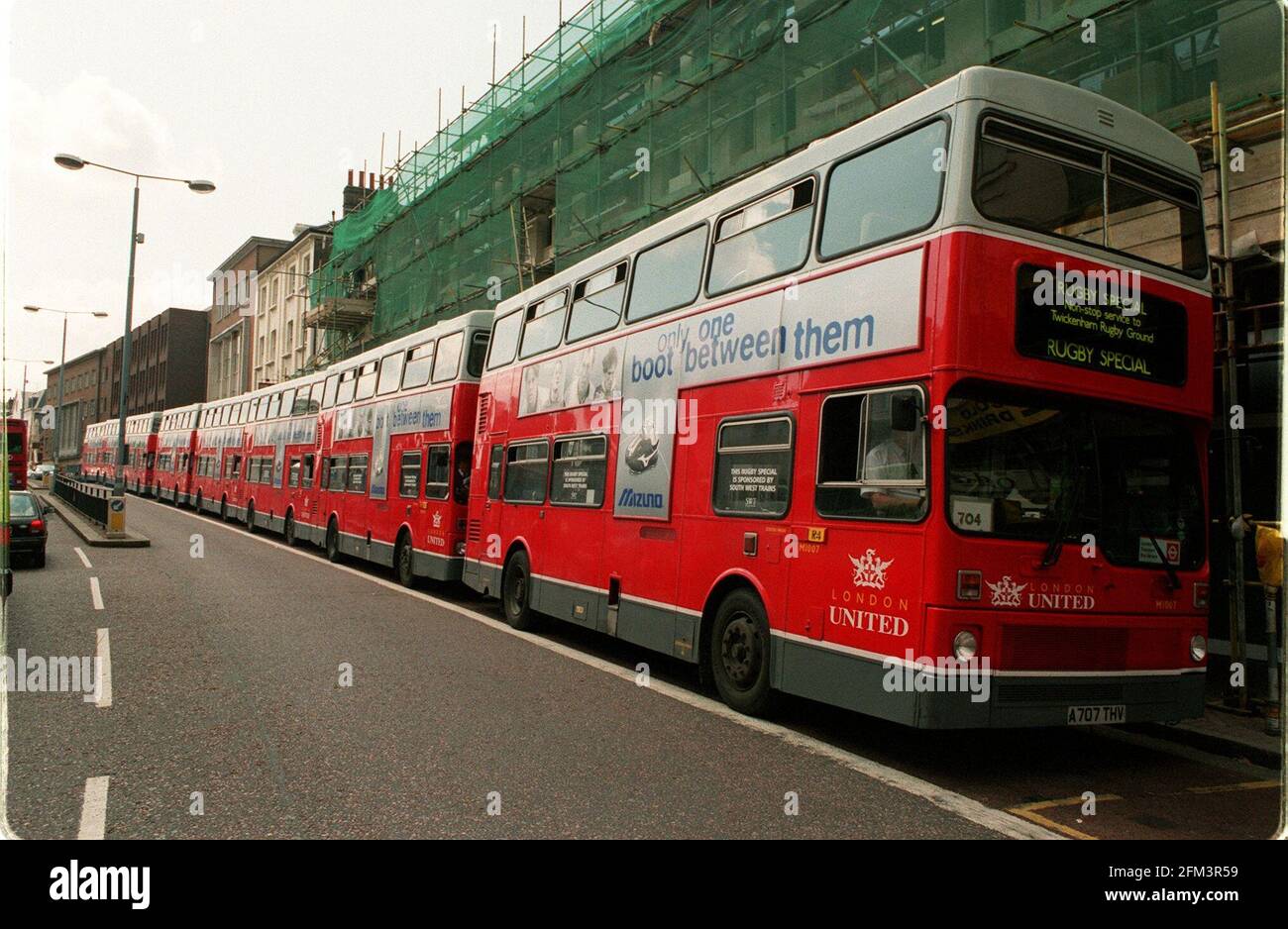 Buses queue up waiting for their passengers Stock Photo - Alamy