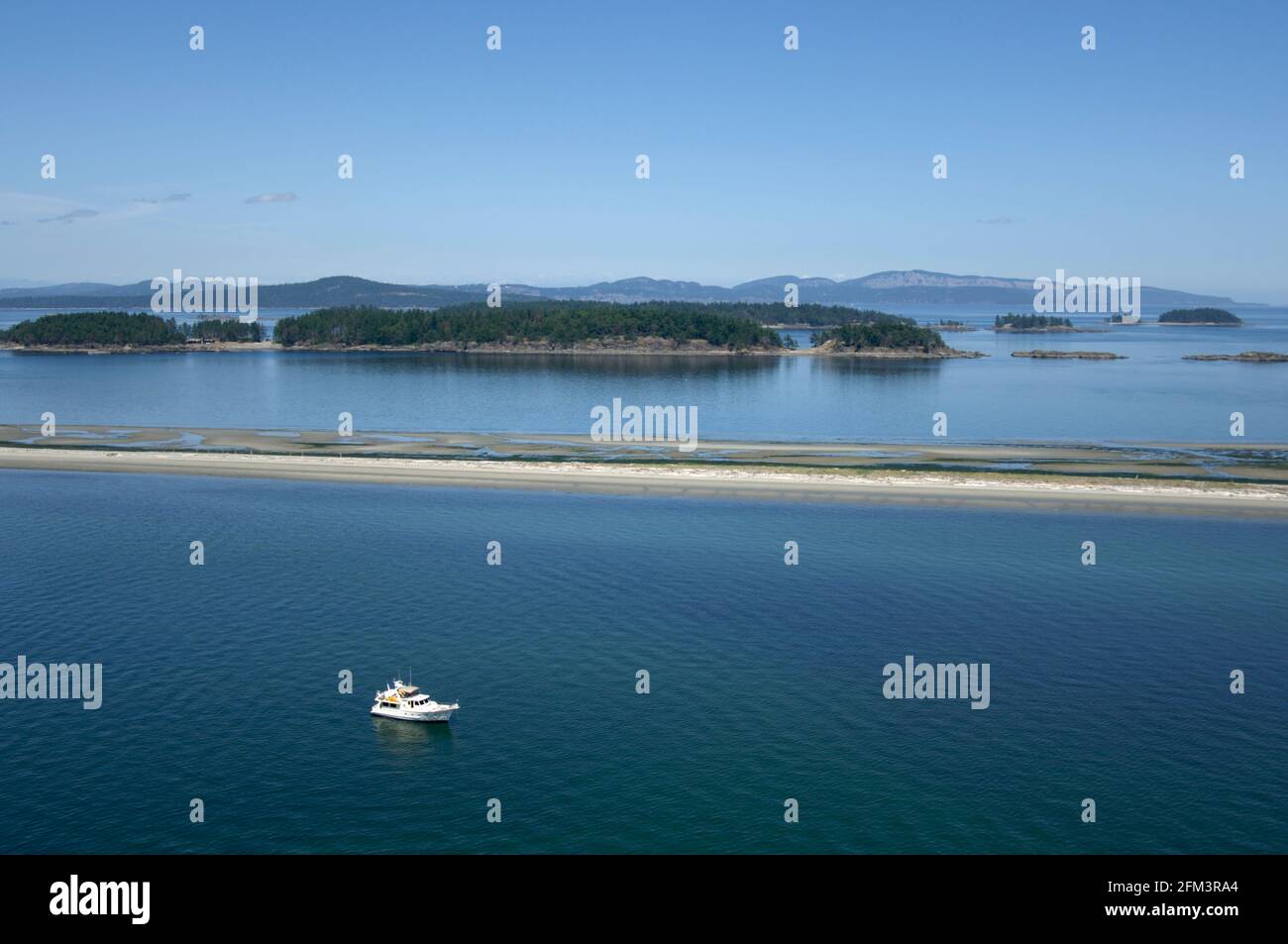 Motorboat at anchor at Sidney Spit, Gulf Islands National Park Reserve ...