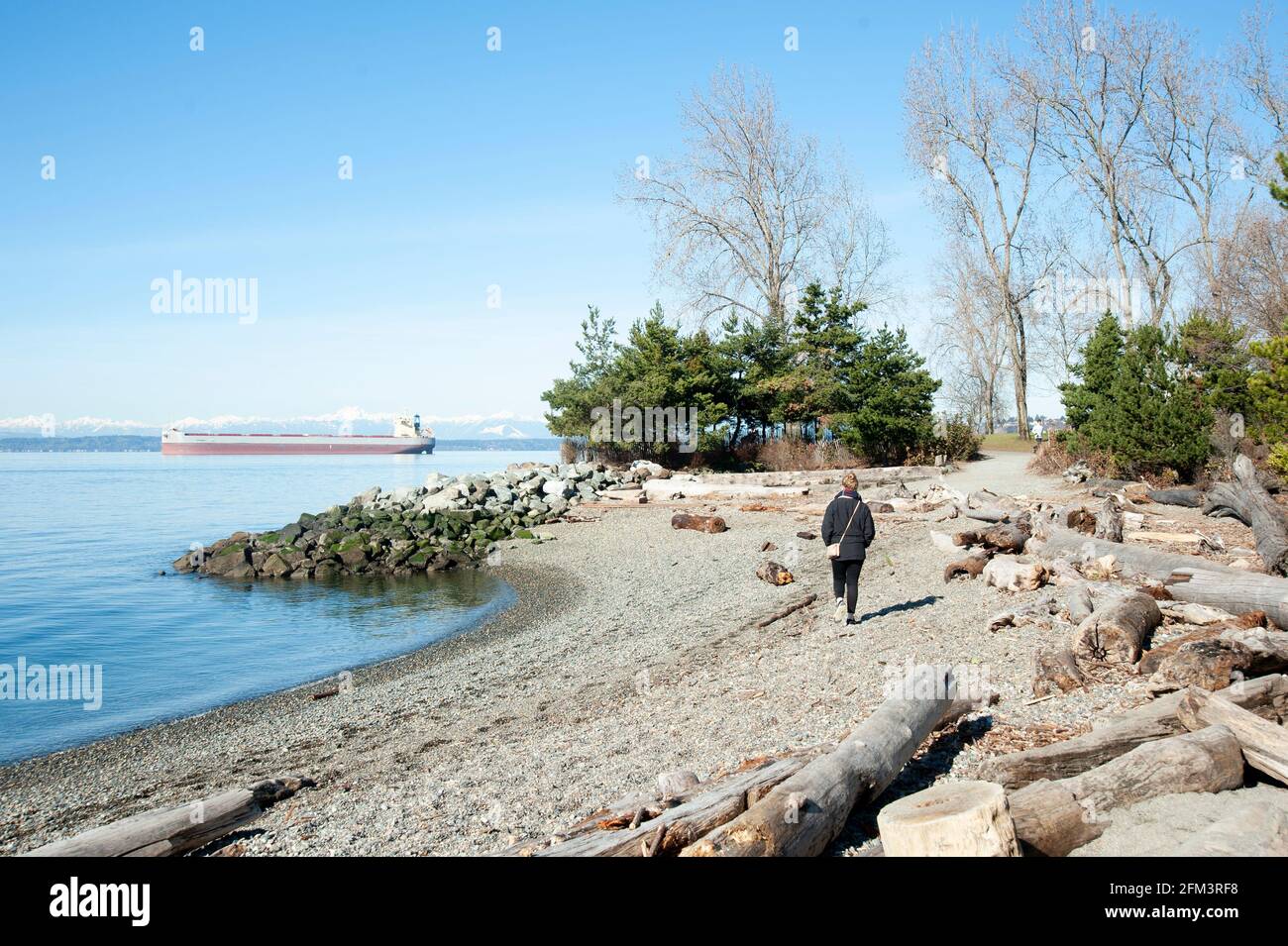 Woman Walking in Olympic Sculpture Park Pocket Beach Stock Photo - Alamy