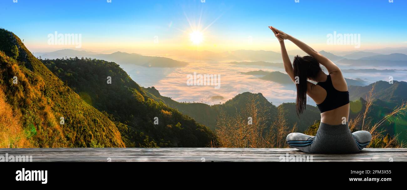 Young woman practicing yoga in the nature.female happiness. Landscape ...