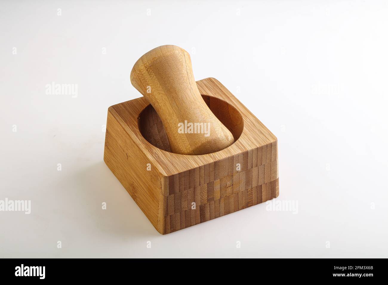 Wooden mortar for kitchen isolated over background Stock Photo - Alamy