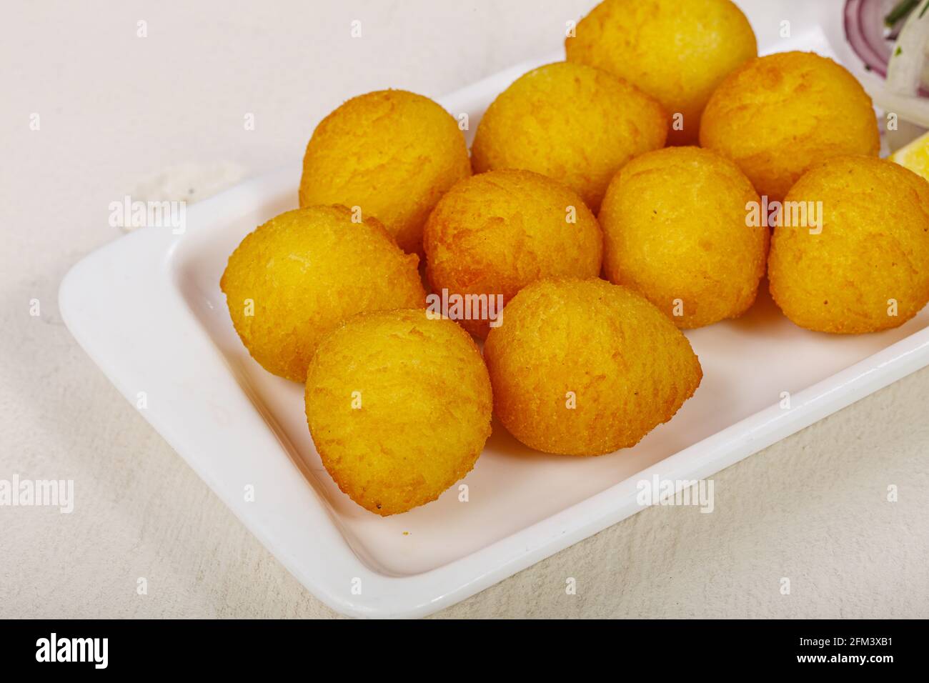 Tasty hot crispy fried potato balls Stock Photo - Alamy