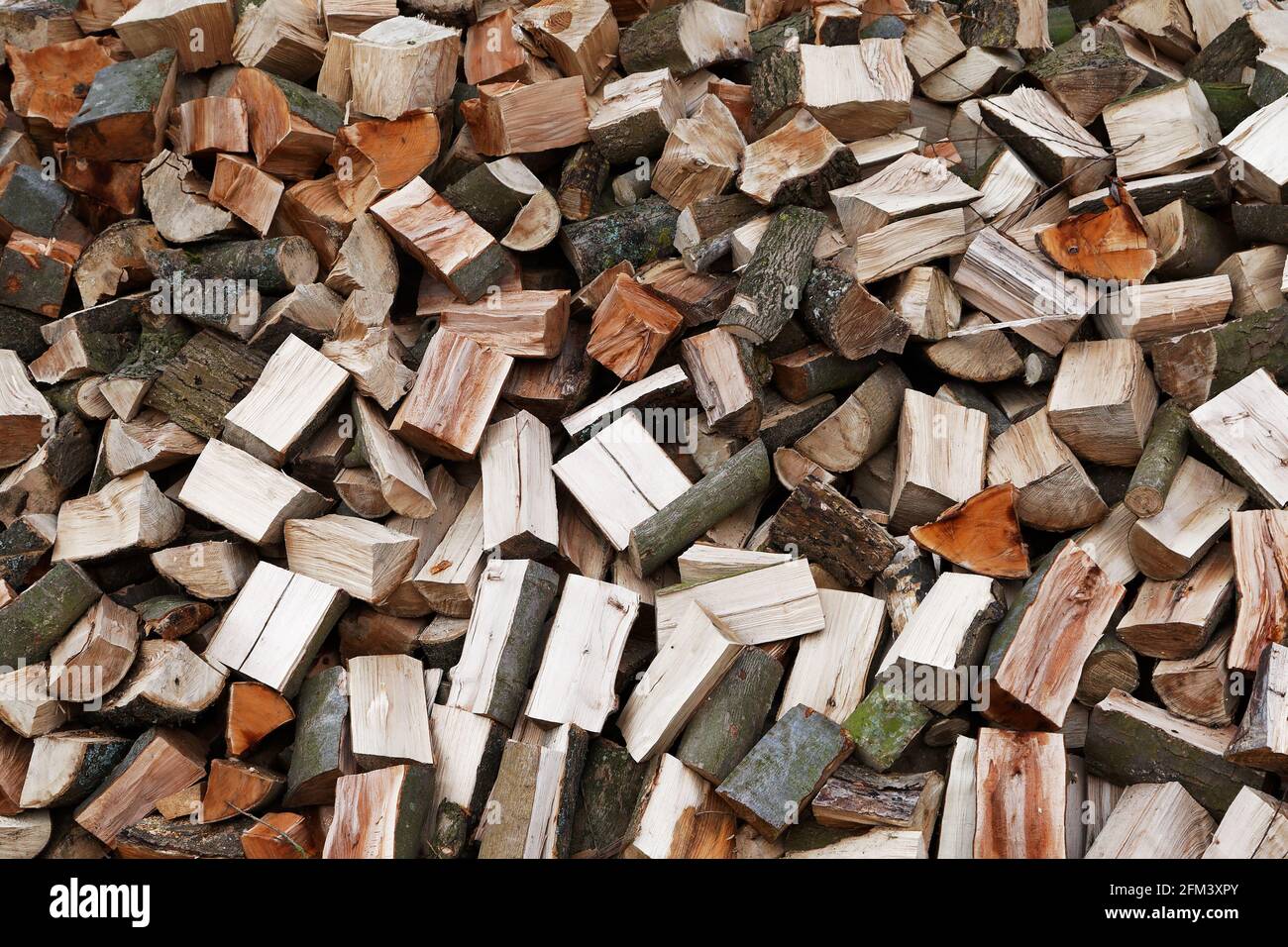 A pile of chopped firewood ready for stacking Stock Photo - Alamy