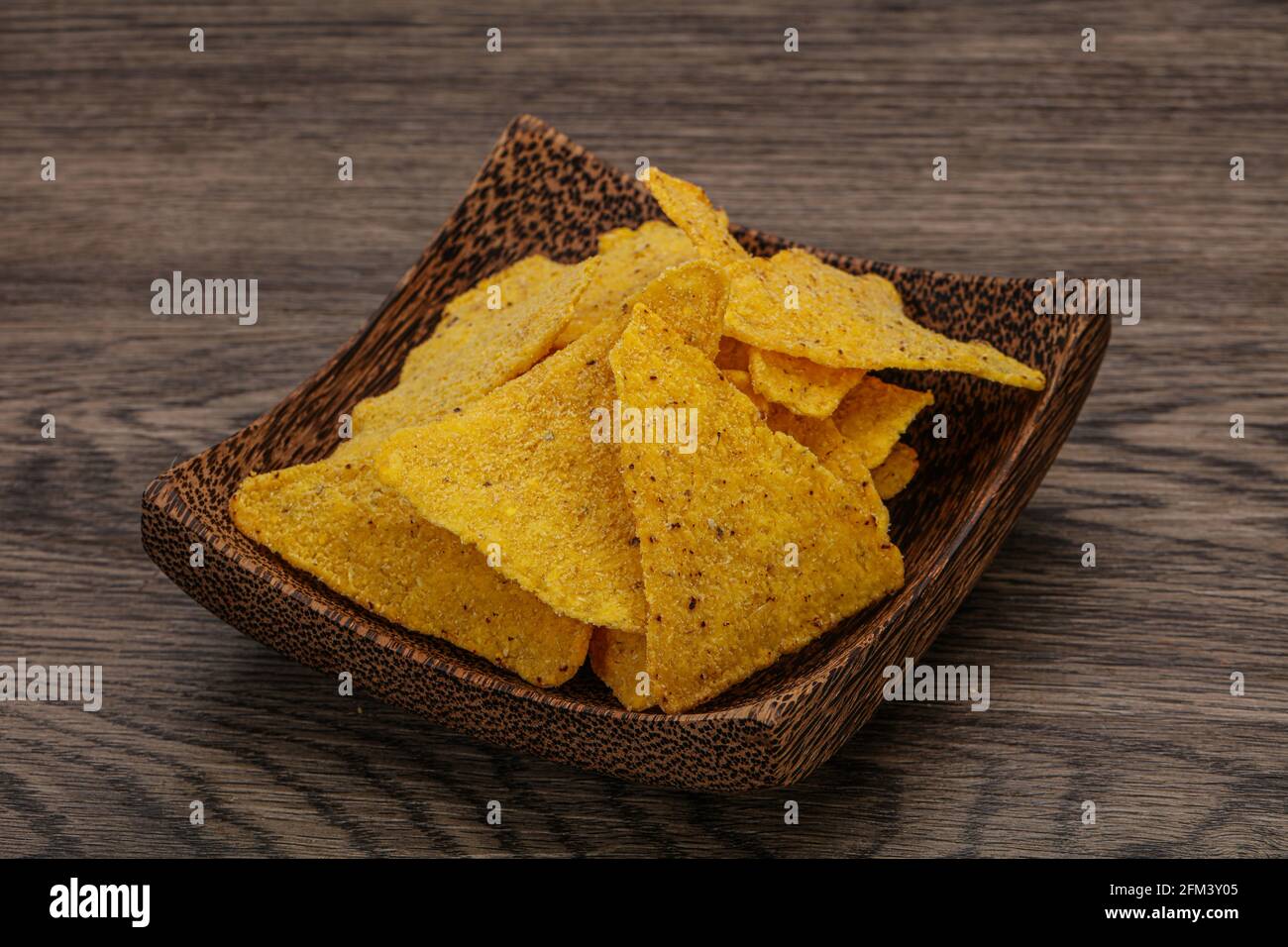 Mexican crunchy corn nachos triangle heap Stock Photo - Alamy