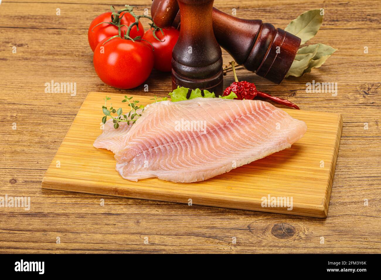 Raw tilapia fish fillet for cooking Stock Photo - Alamy