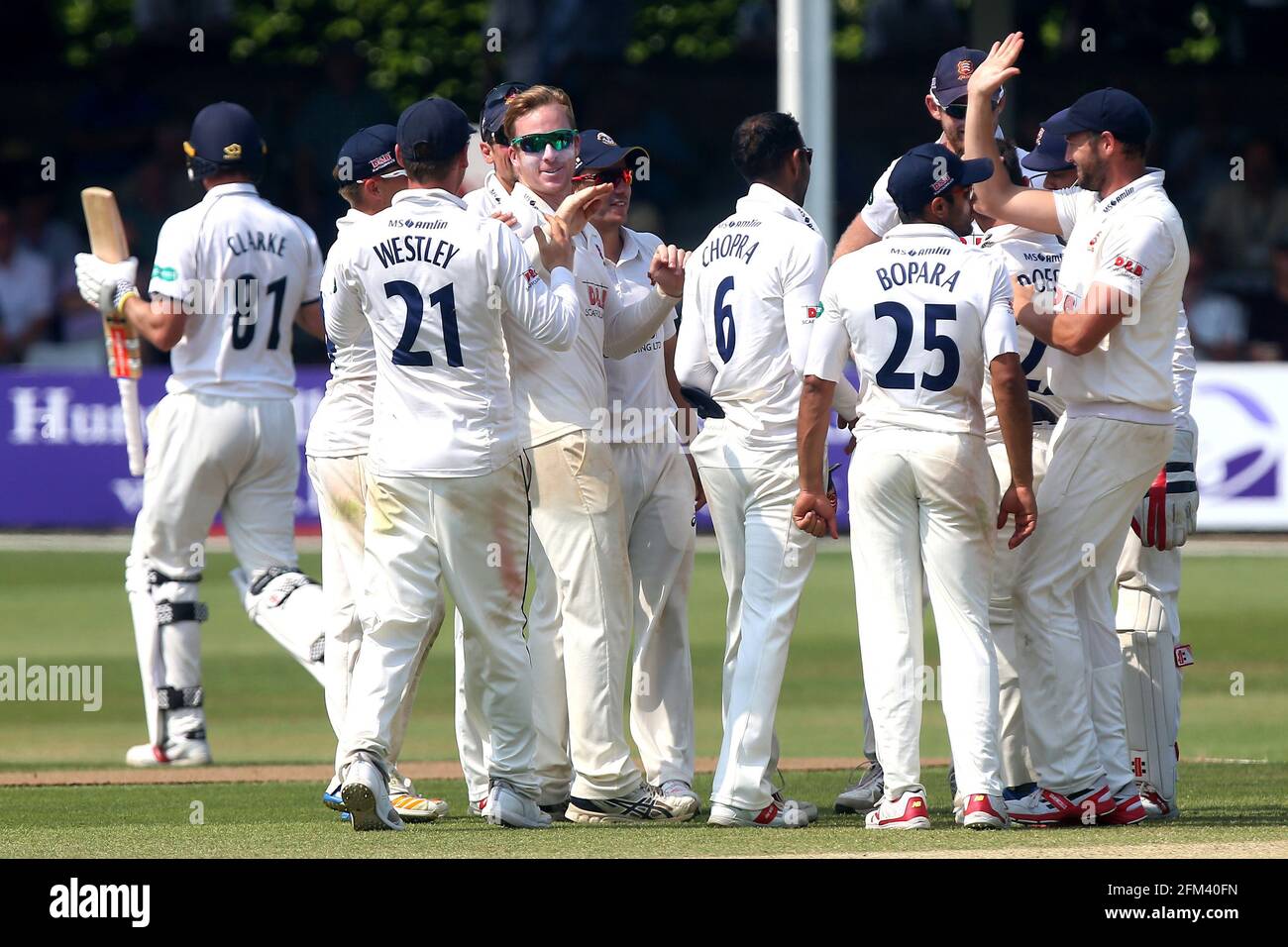 Simon Harmer of Essex is congratulated by his team mates after taking ...