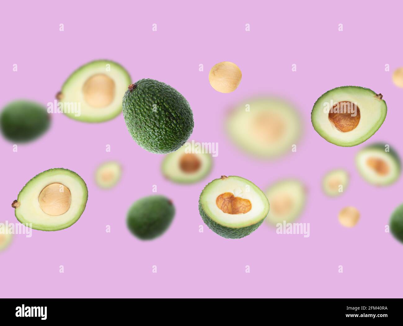 Pattern with flying avocado on bright violet background Stock Photo - Alamy