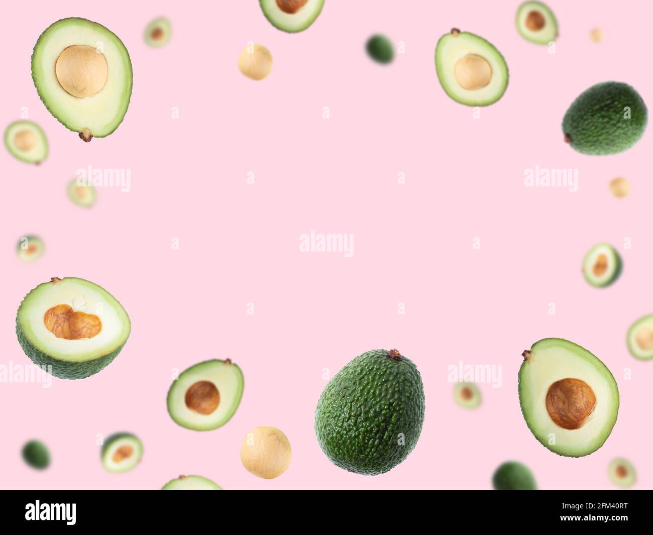 Slised avocado pattern on bright pink background Stock Photo - Alamy