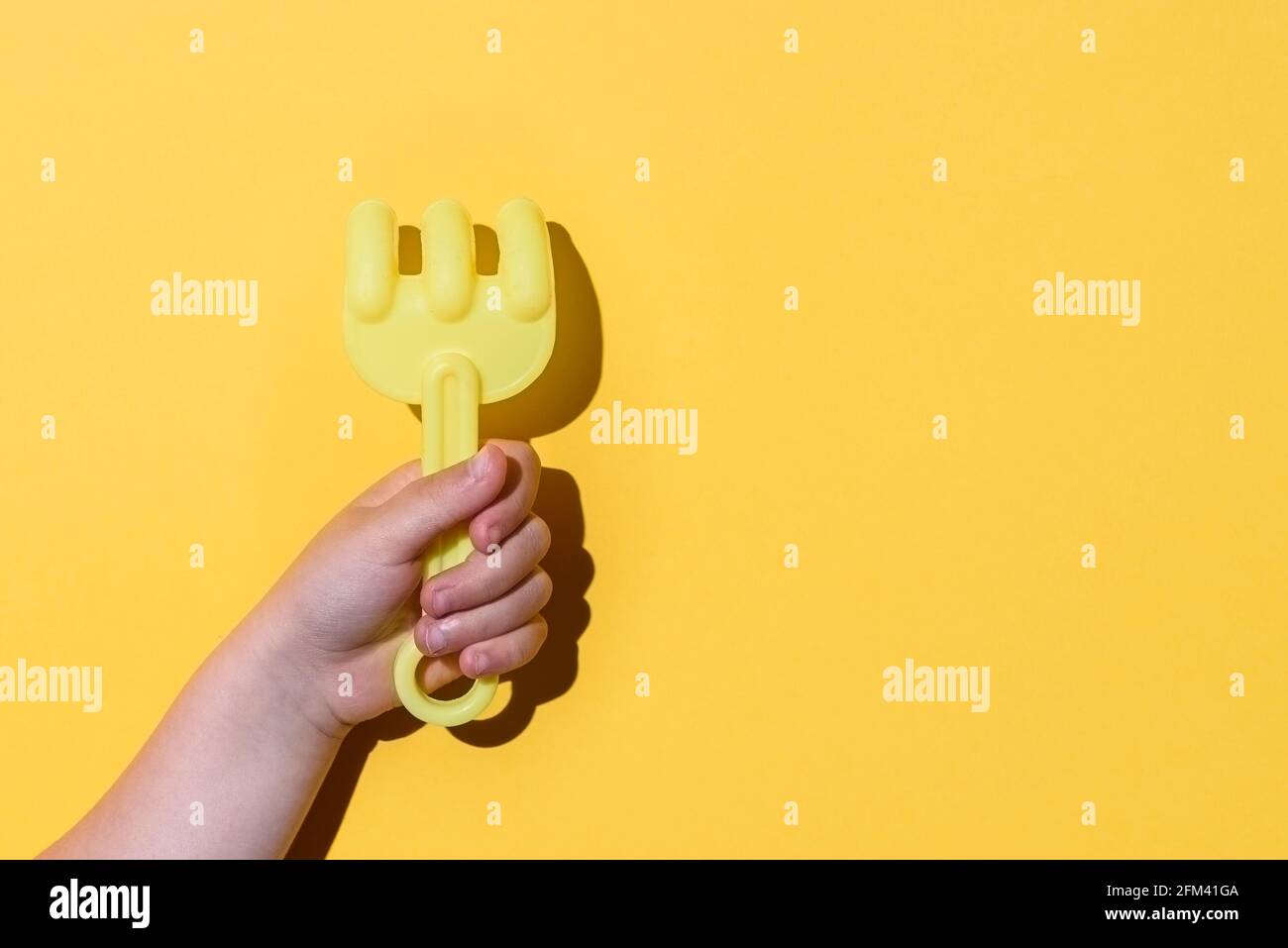 Toy sand rake hi-res stock photography and images - Alamy