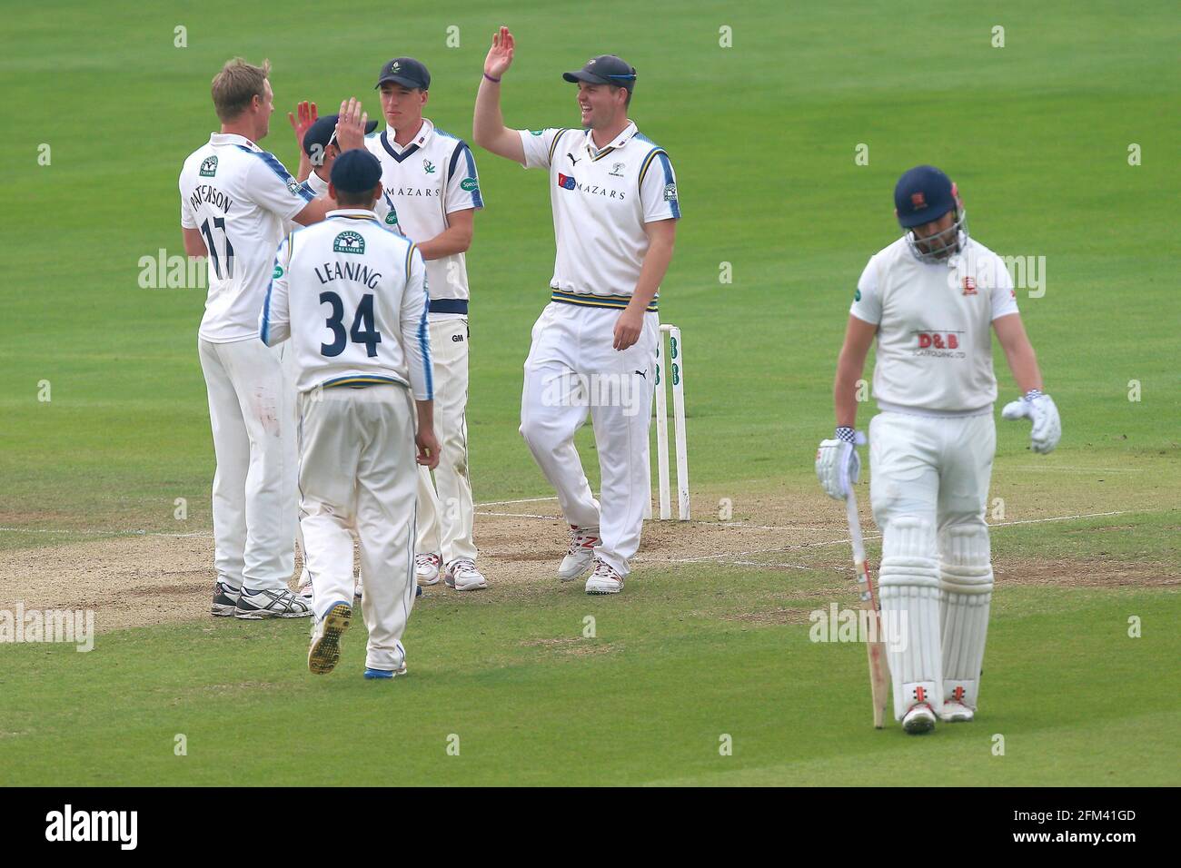 Steven Patterson of Yorkshire is congratulated by his team mates after ...