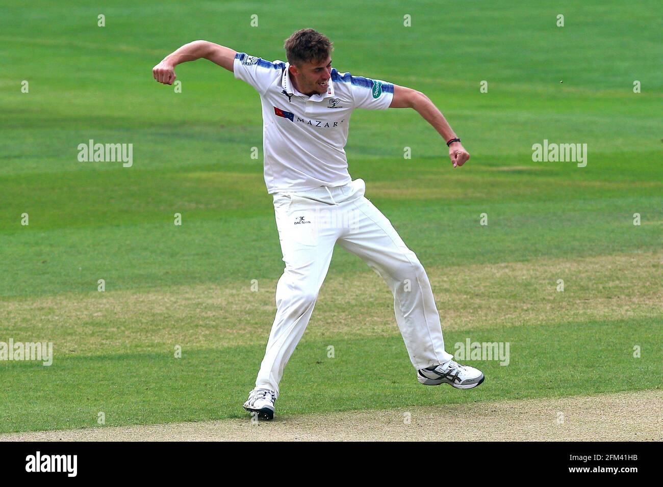 Ben Coad of Yorkshire celebrates taking the wicket of Daniel Lawrence ...