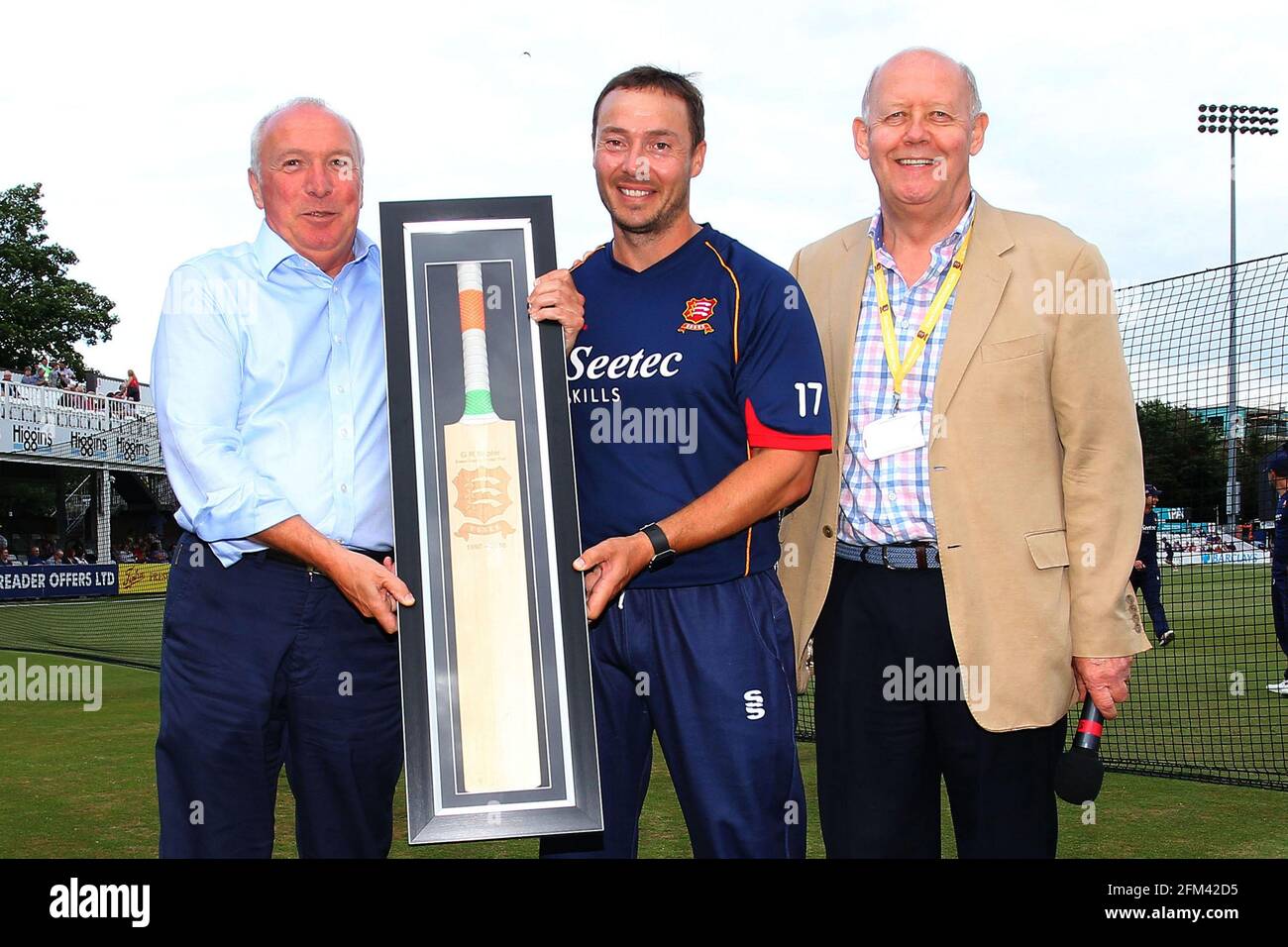 Graham Napier (C) of Essex receives a presentation from Chief Executive ...
