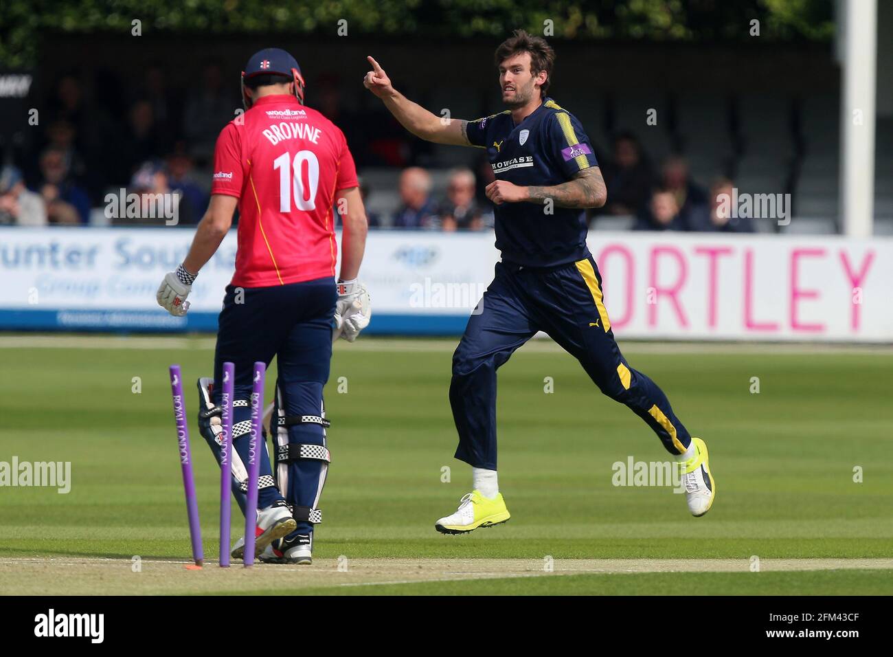 Reece Topley of Hampshire celebrates taking the wicket of Nick Browne ...