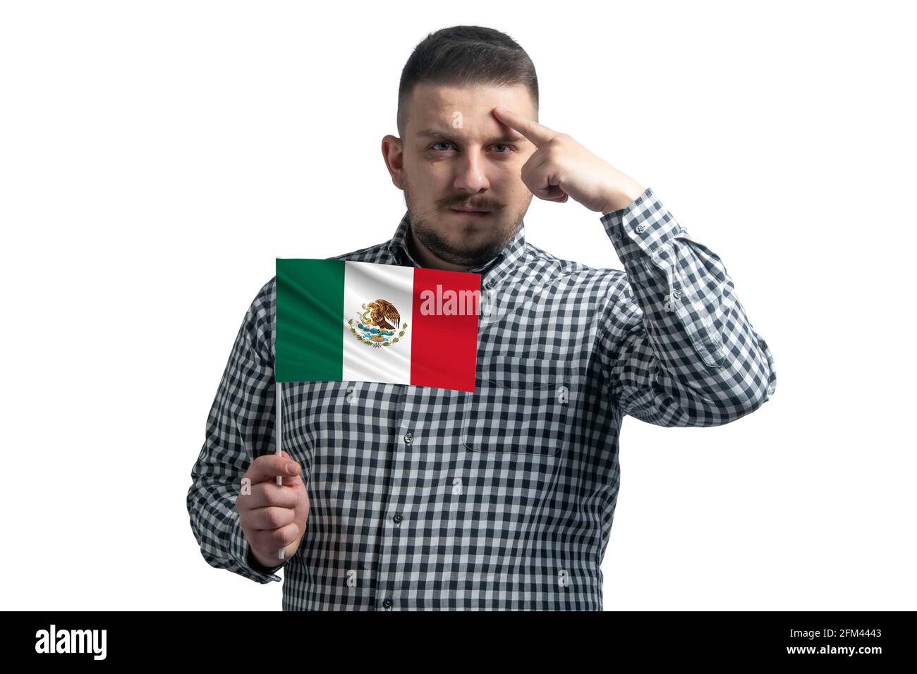 White guy holding a flag of Mexico and a finger touches the temple on ...