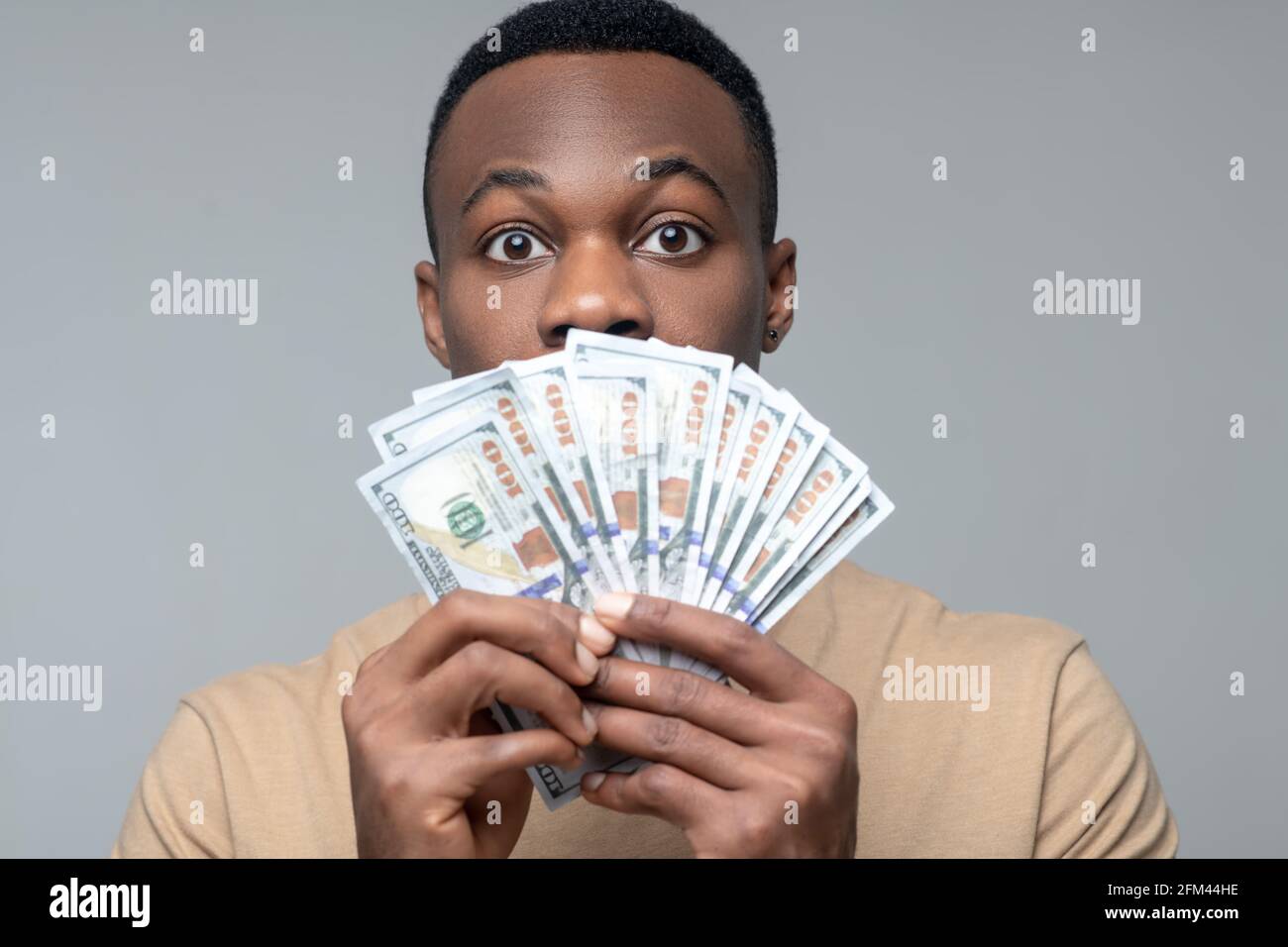 Man holding banknotes hi-res stock photography and images - Alamy