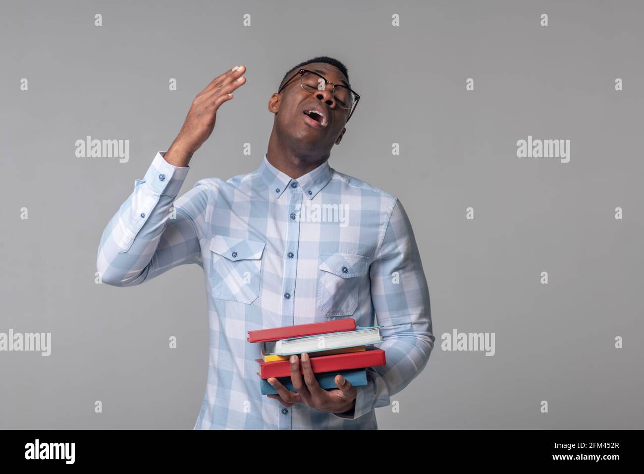 Sleepy african man yawning standing hi-res stock photography and images ...