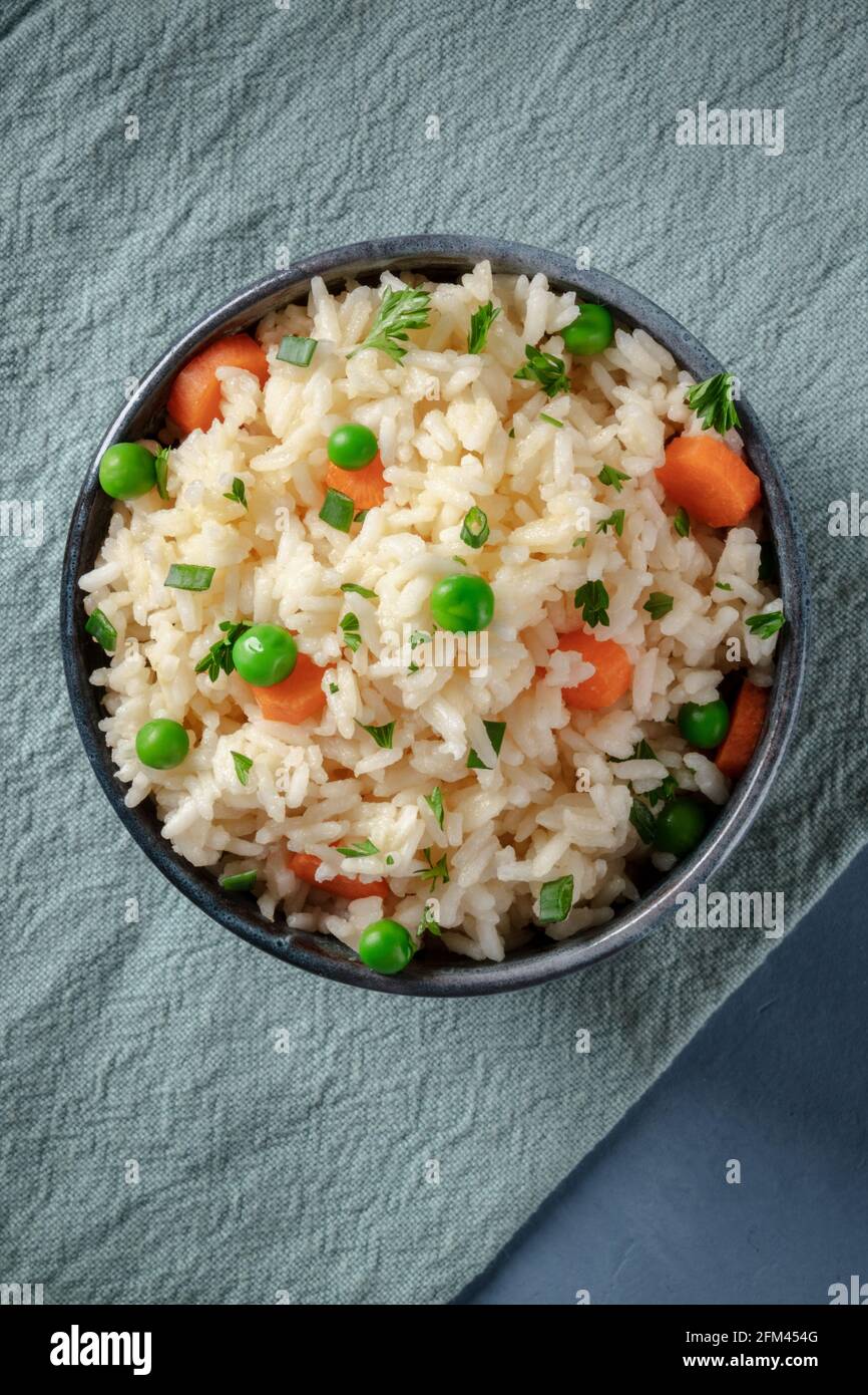 Vegan rice, shot from above on a blue background with a place for text ...