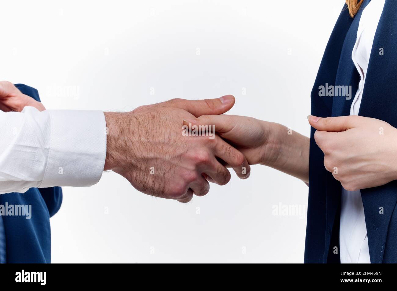 work colleagues shake hands communication contract light background ...