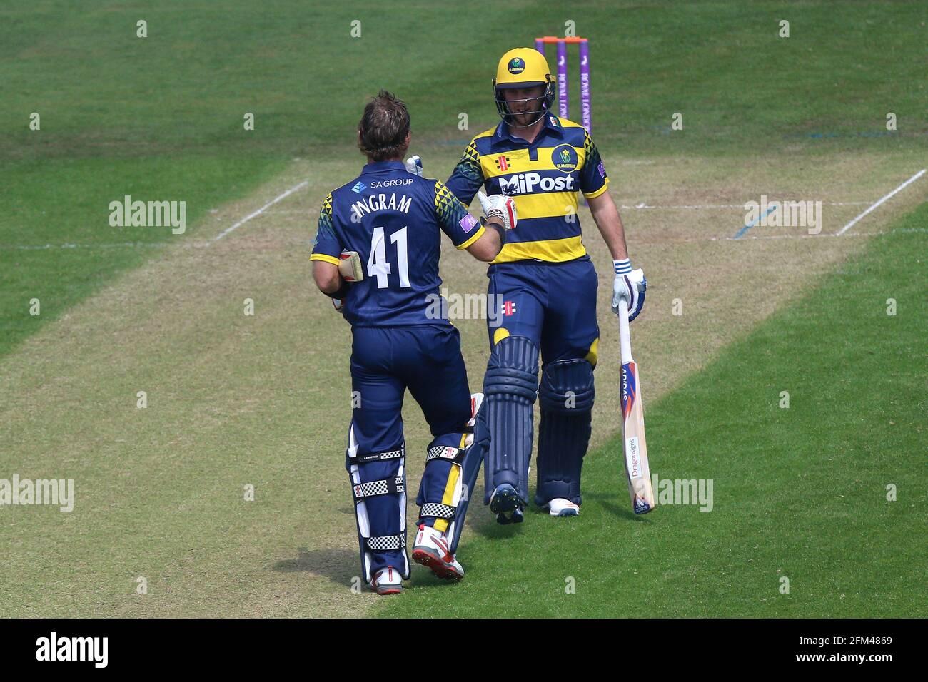 Chris Cooke of Glamorgan congratulates Colin Ingram on his century ...
