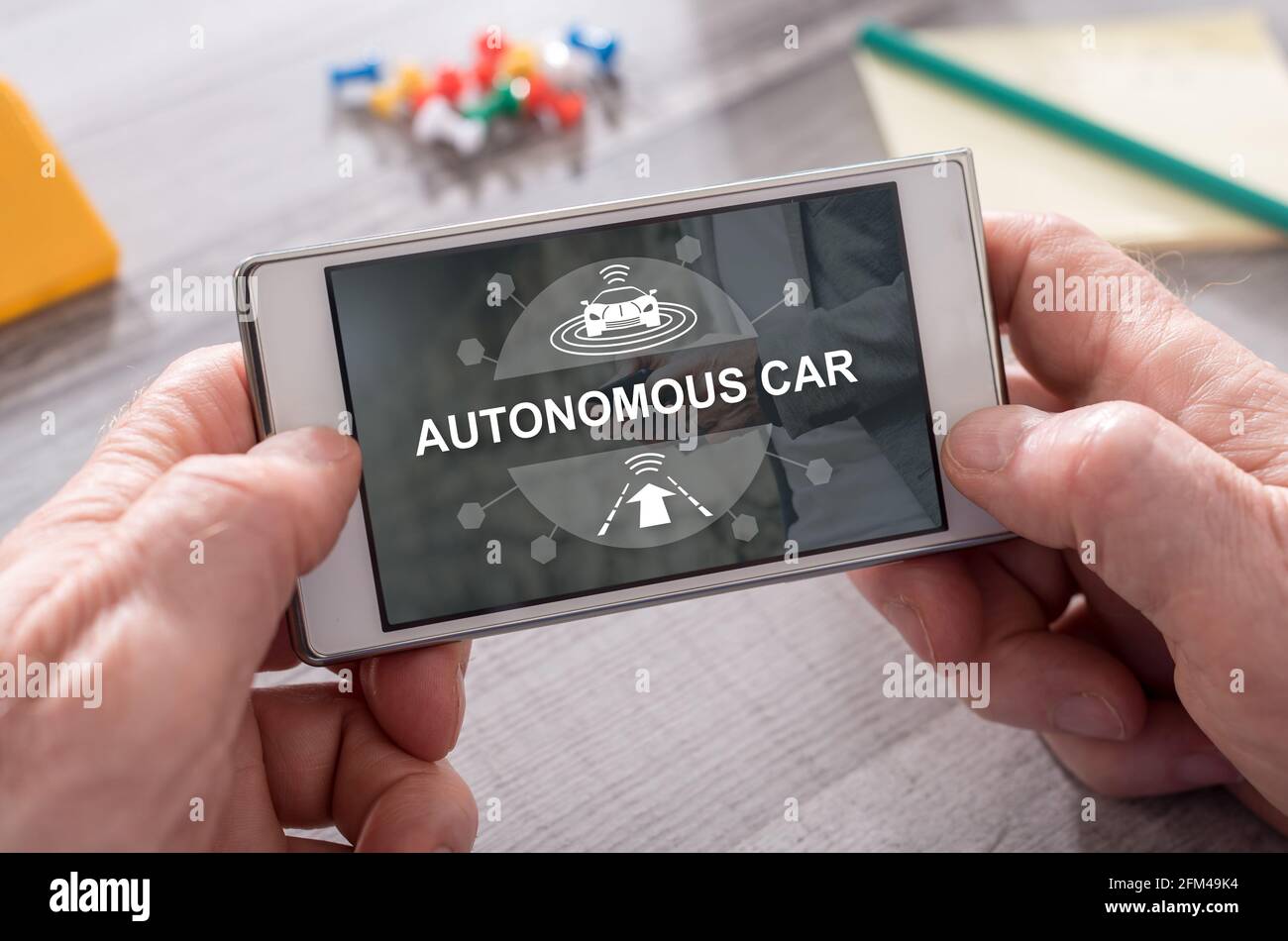 Autonomous car concept on mobile phone Stock Photo - Alamy