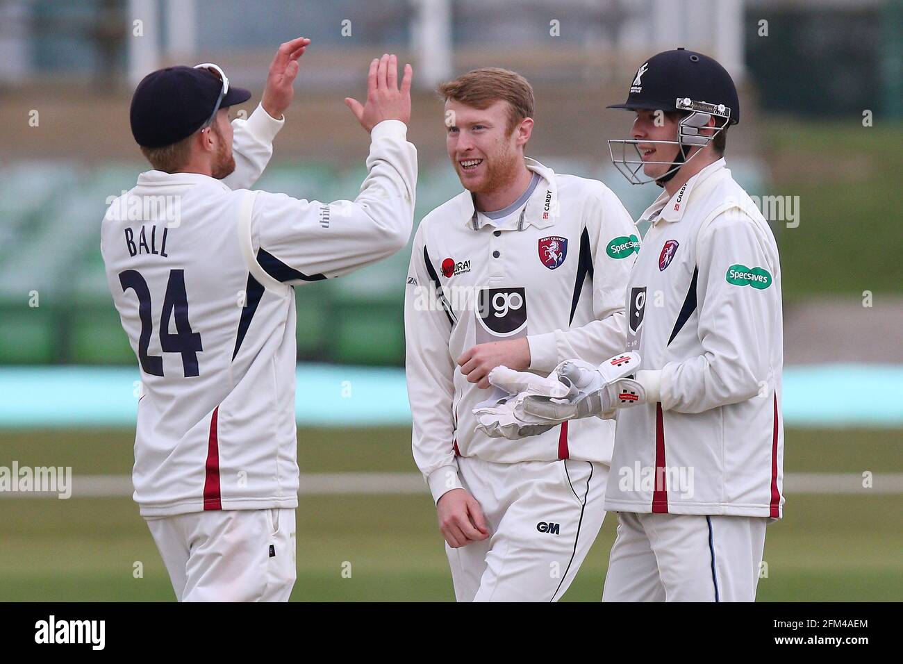 Adam Riley of Kent (C) celebrates taking the wicket of Callum Taylor ...