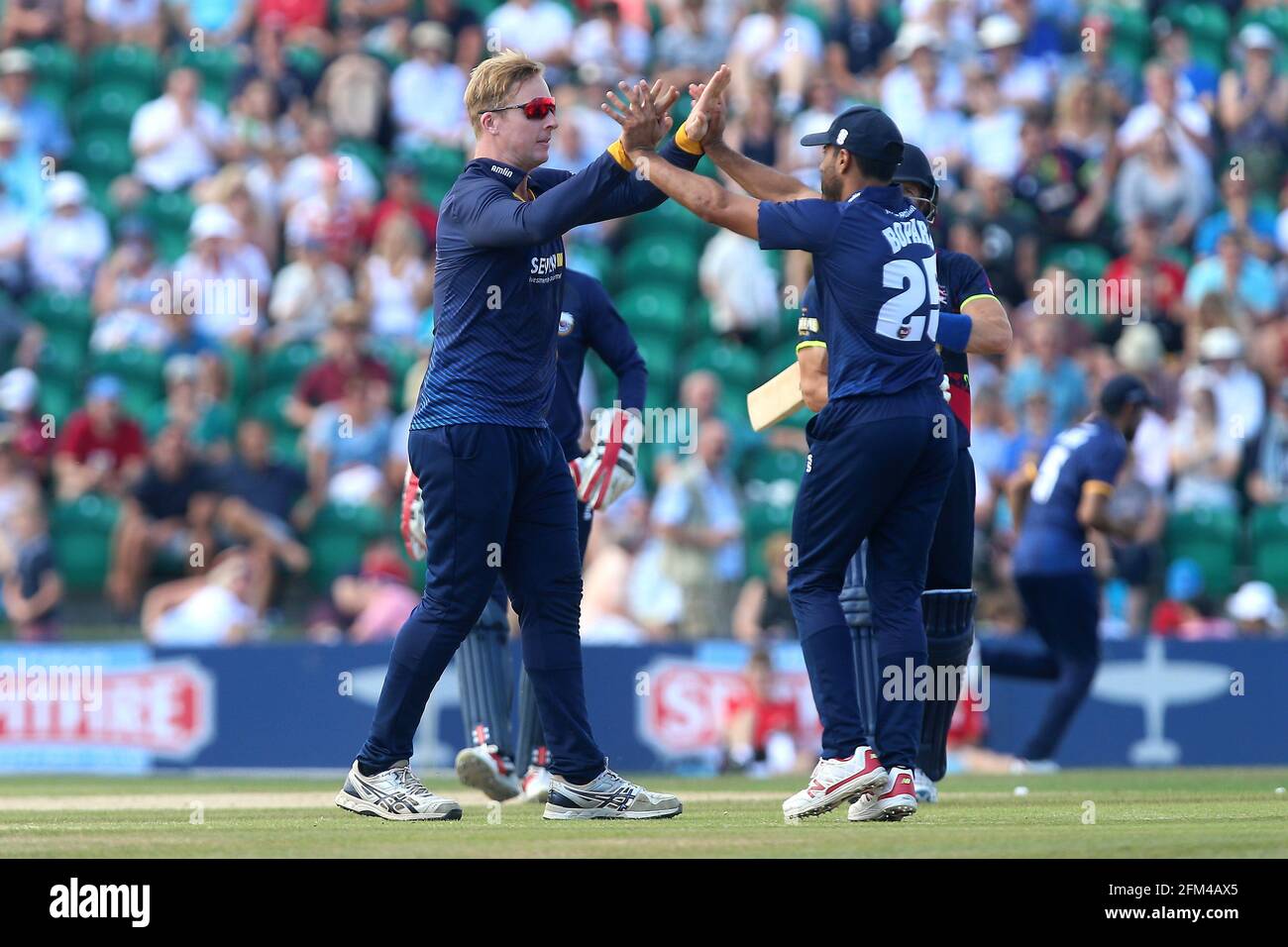 Simon Harmer of Essex celebrates taking the wicket of Joe Denly during ...