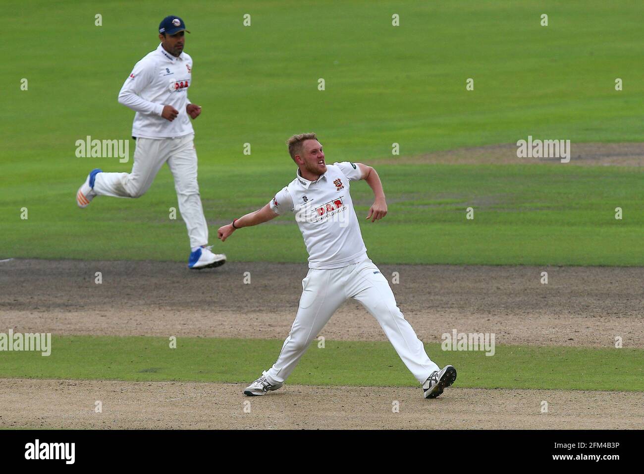 Jamie Porter of Essex celebrates taking the wicket of Dane Vilas during ...