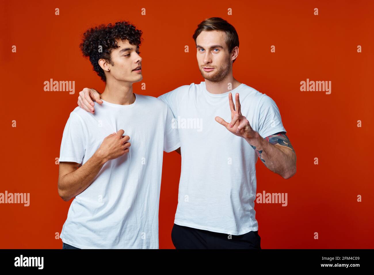 two men hugging friendship communication lifestyle fun Stock Photo - Alamy