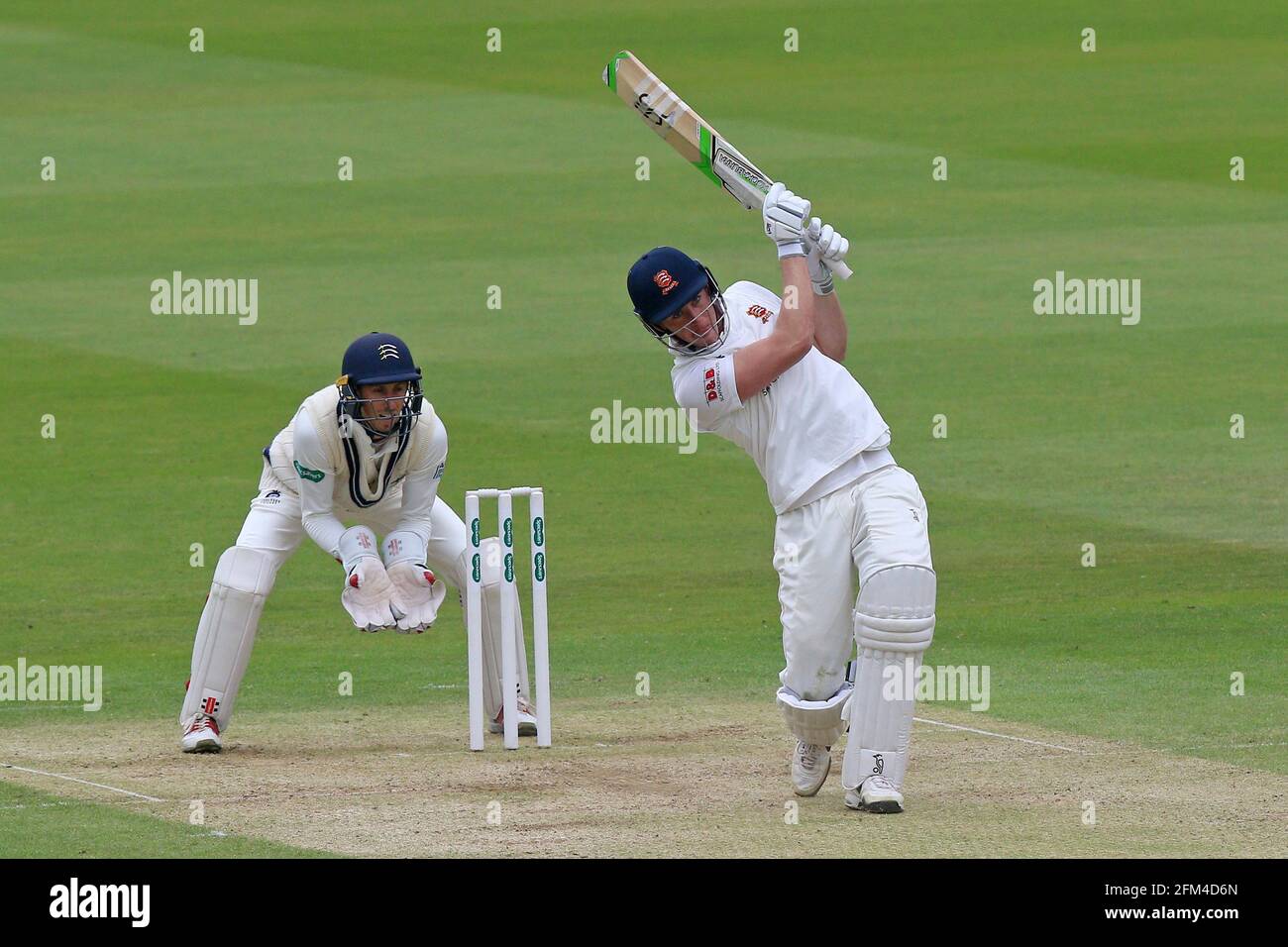 Daniel Lawrence hits four runs for Essex as John Simpson looks on from ...
