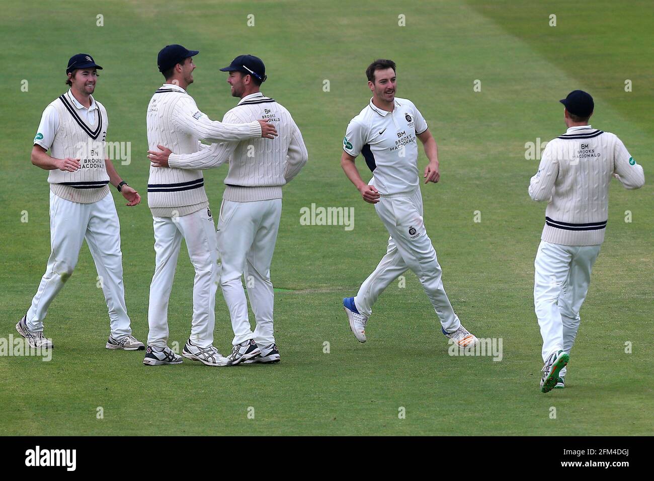 Toby Roland-Jones (2nd R) of Middlesex celebrates taking the wicket of ...