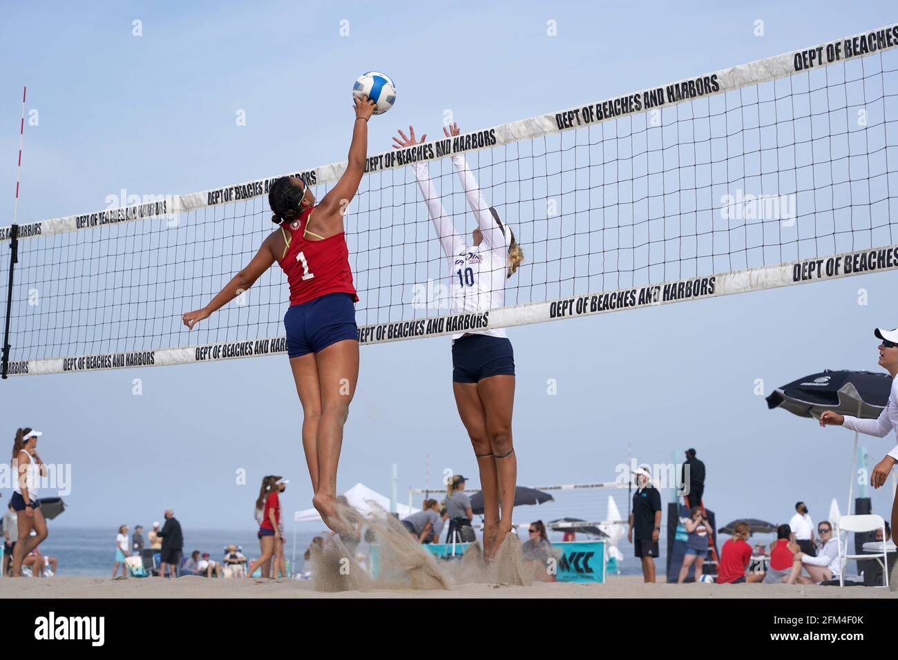 Cassie Chinn of Loyola Marymount (1) hits the ball over Cameron ...