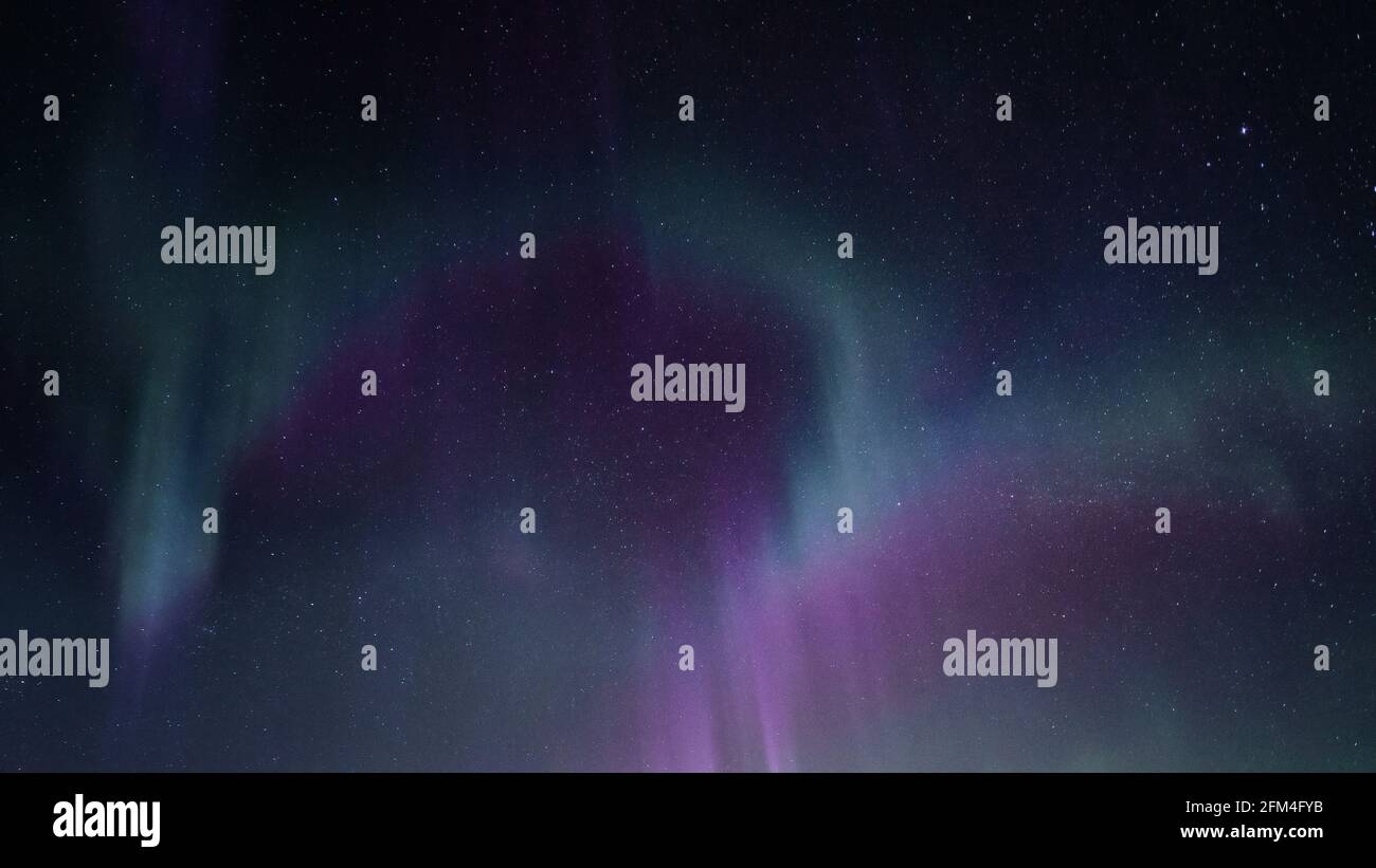 Beautiful curved Aurora Borealis - bright green magenta and purple ...