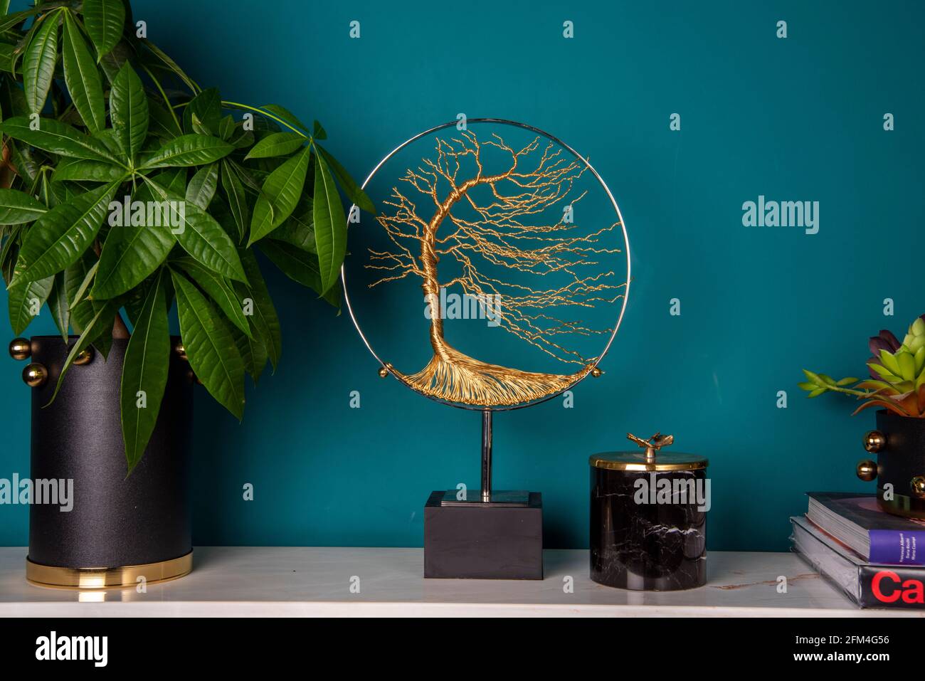 decorative objects on table with plants Stock Photo - Alamy