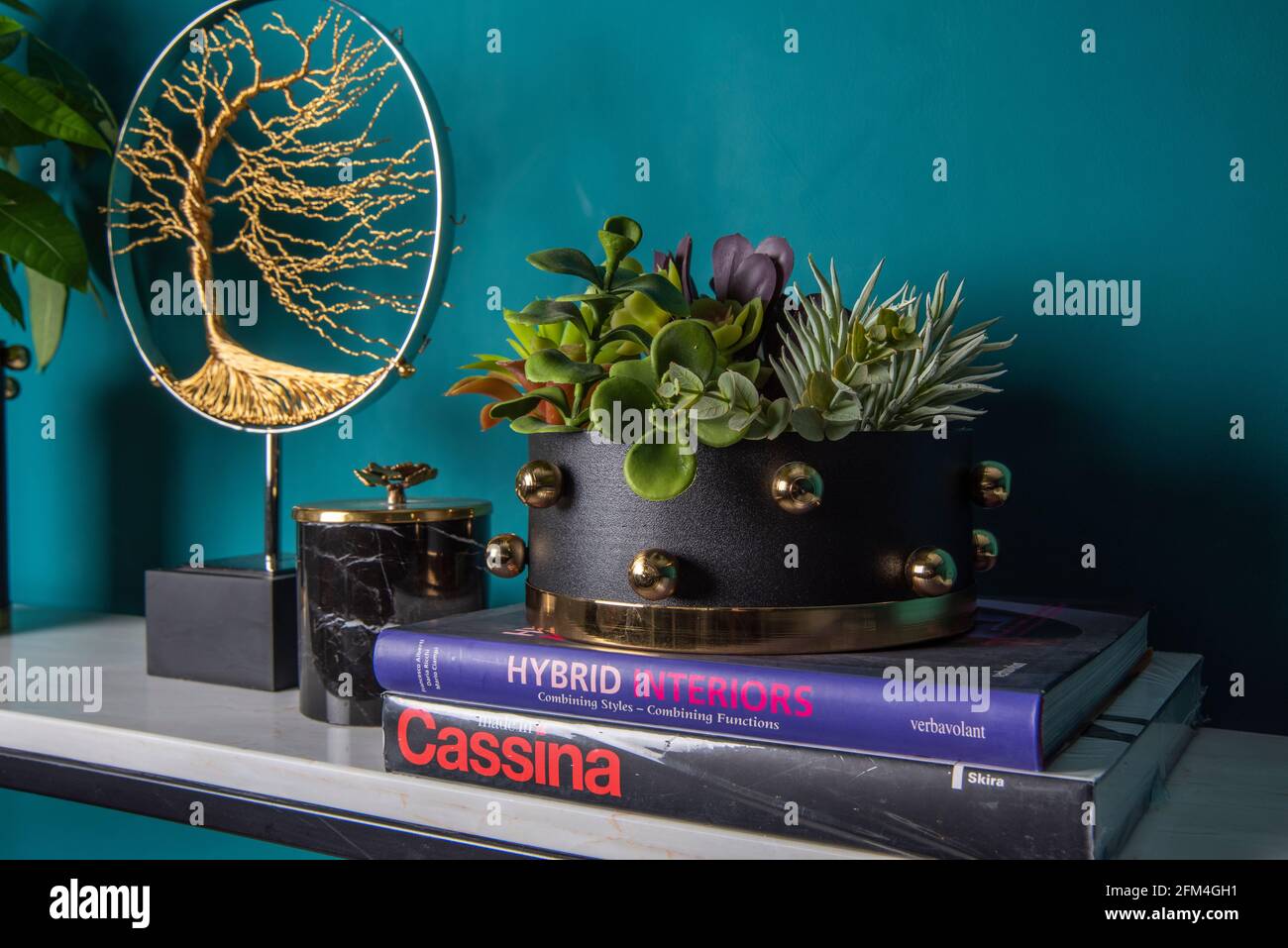 decorative objects on table with plants Stock Photo - Alamy