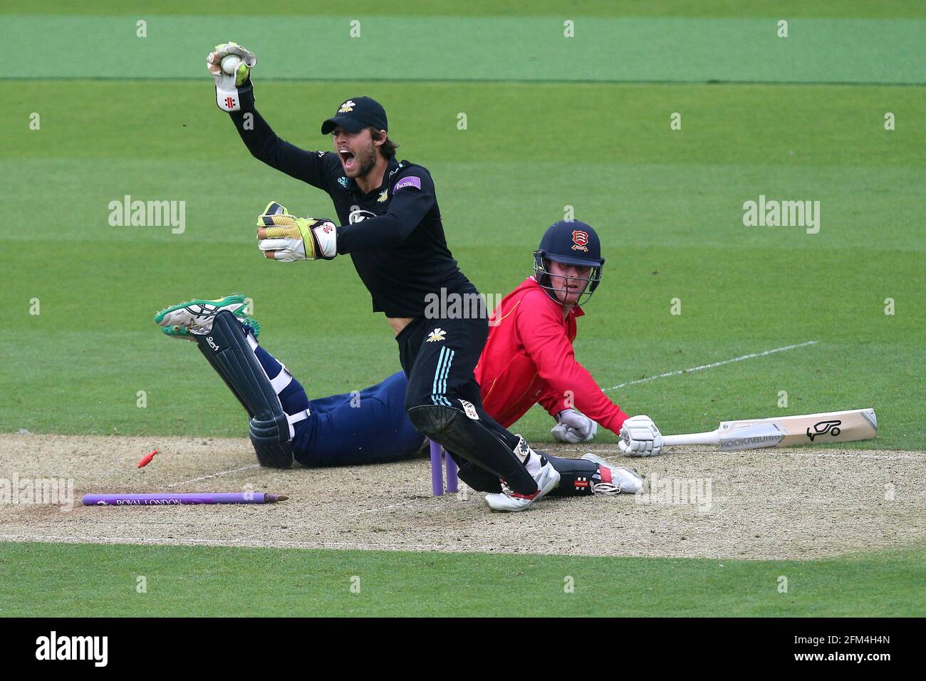 Ben Foakes of Surrey appeals for the run out of Simon Harmer during ...