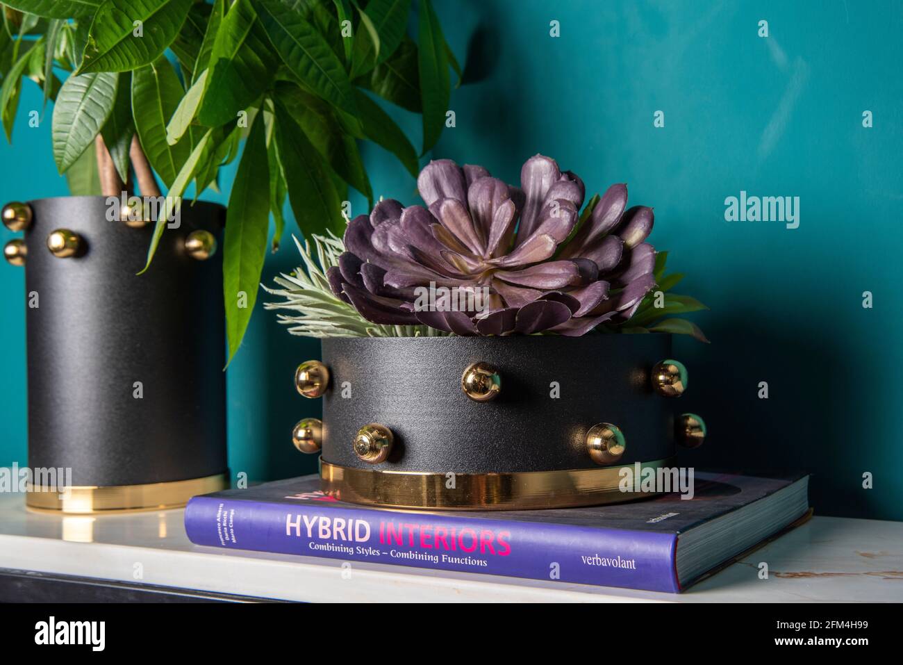 decorative objects on table with plants Stock Photo - Alamy