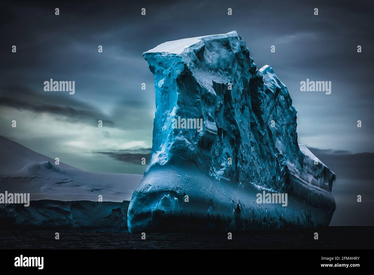 Antarctic iceberg in the snow floating in open ocean. Beauty world ...