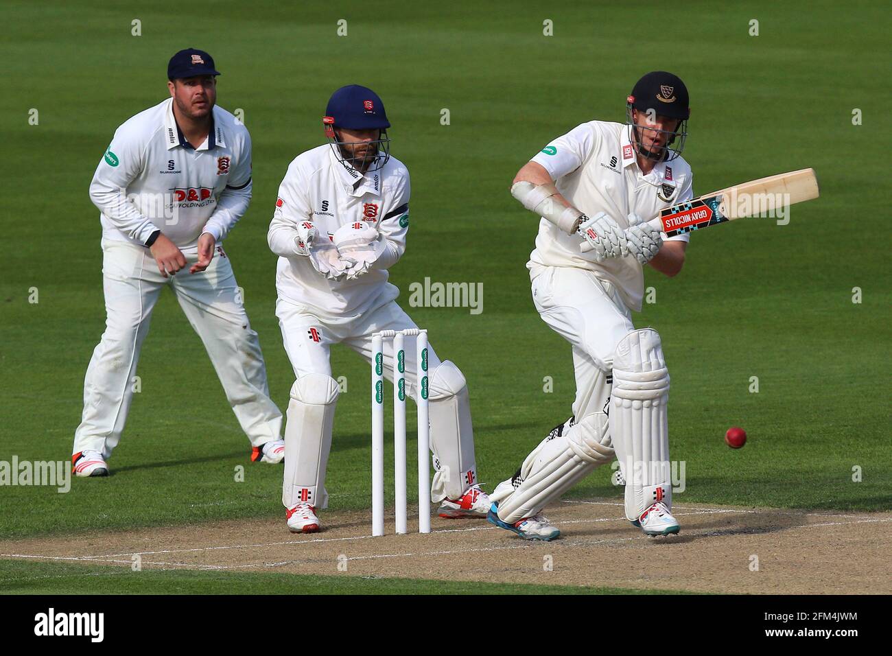 Luke Wells in batting action for Sussex as James Foster looks on from ...
