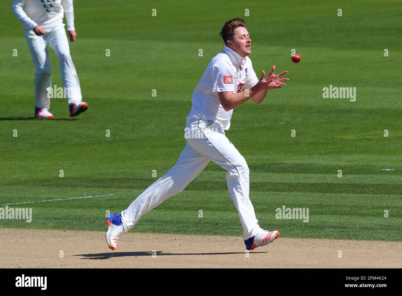 Oliver Robinson of Sussex takes a catch from his own bowling to dismiss ...