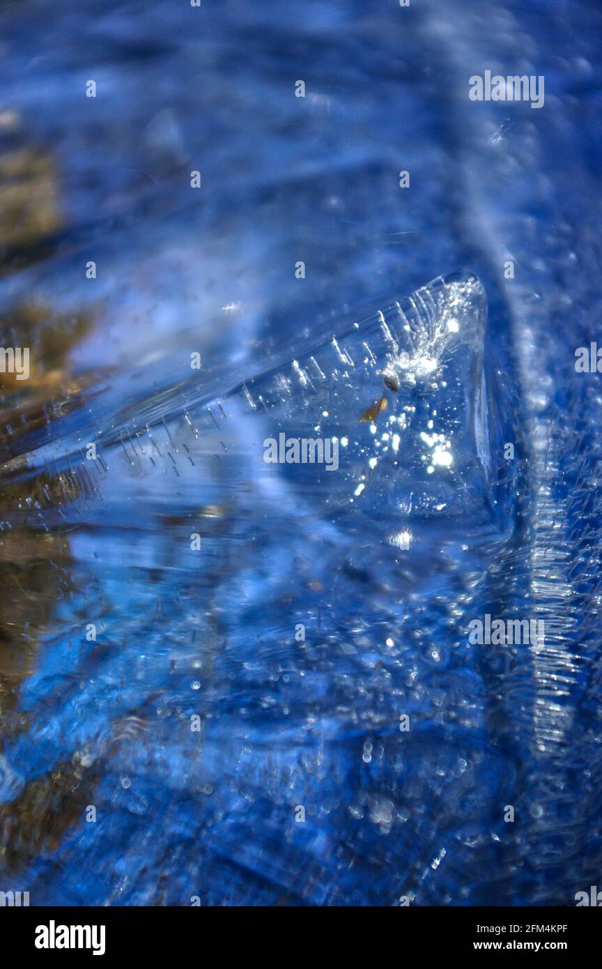Closeup of ice formed by the cold weather outside - blue ice block ...