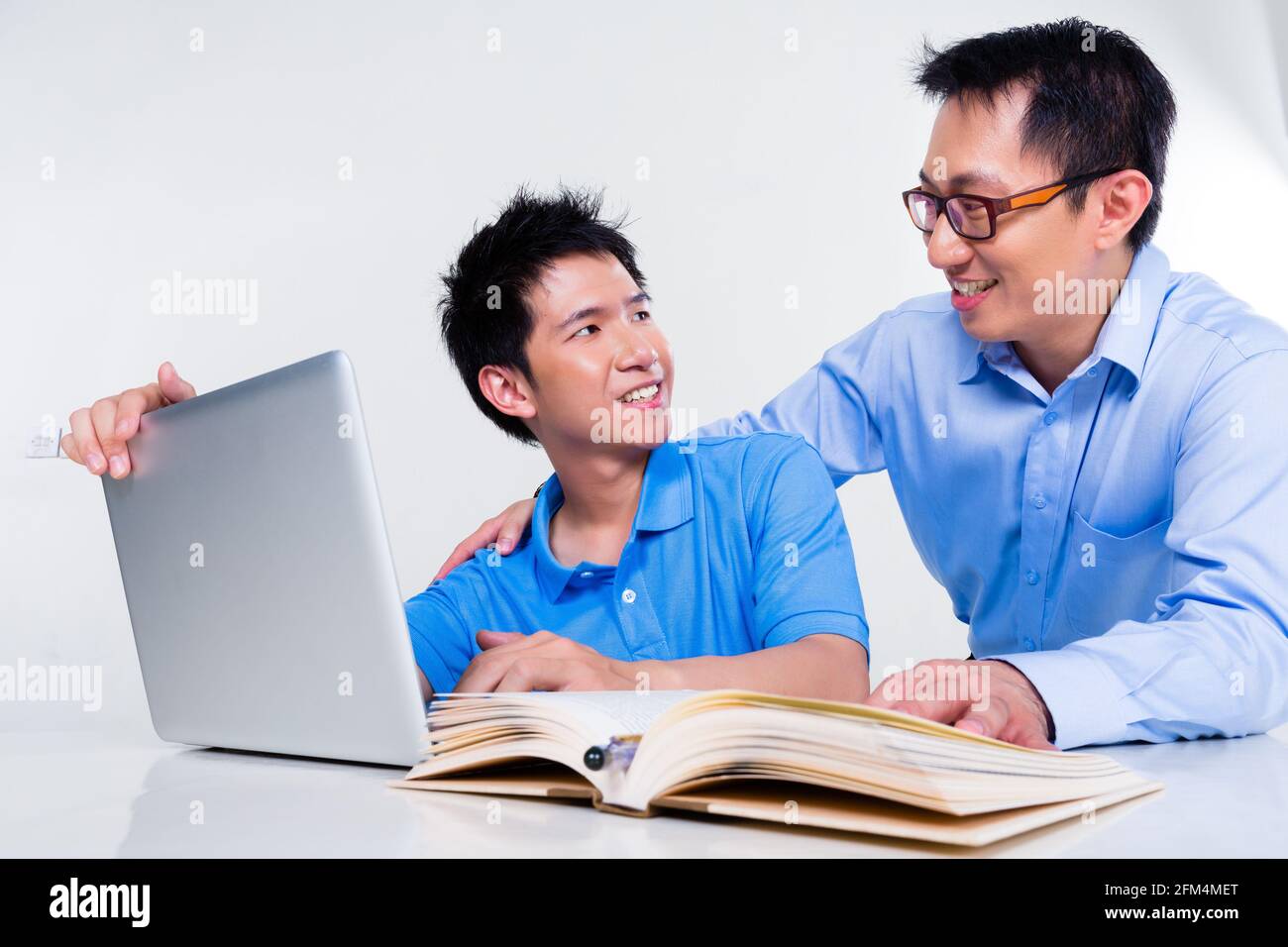 Chinese father helps his son with knowledge and experience for his ...