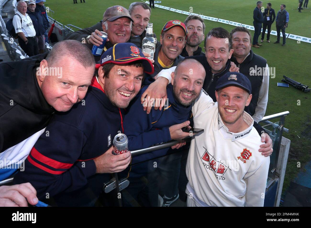 Jamie Porter of Essex poses for a photograph with jubilant Essex fans ...
