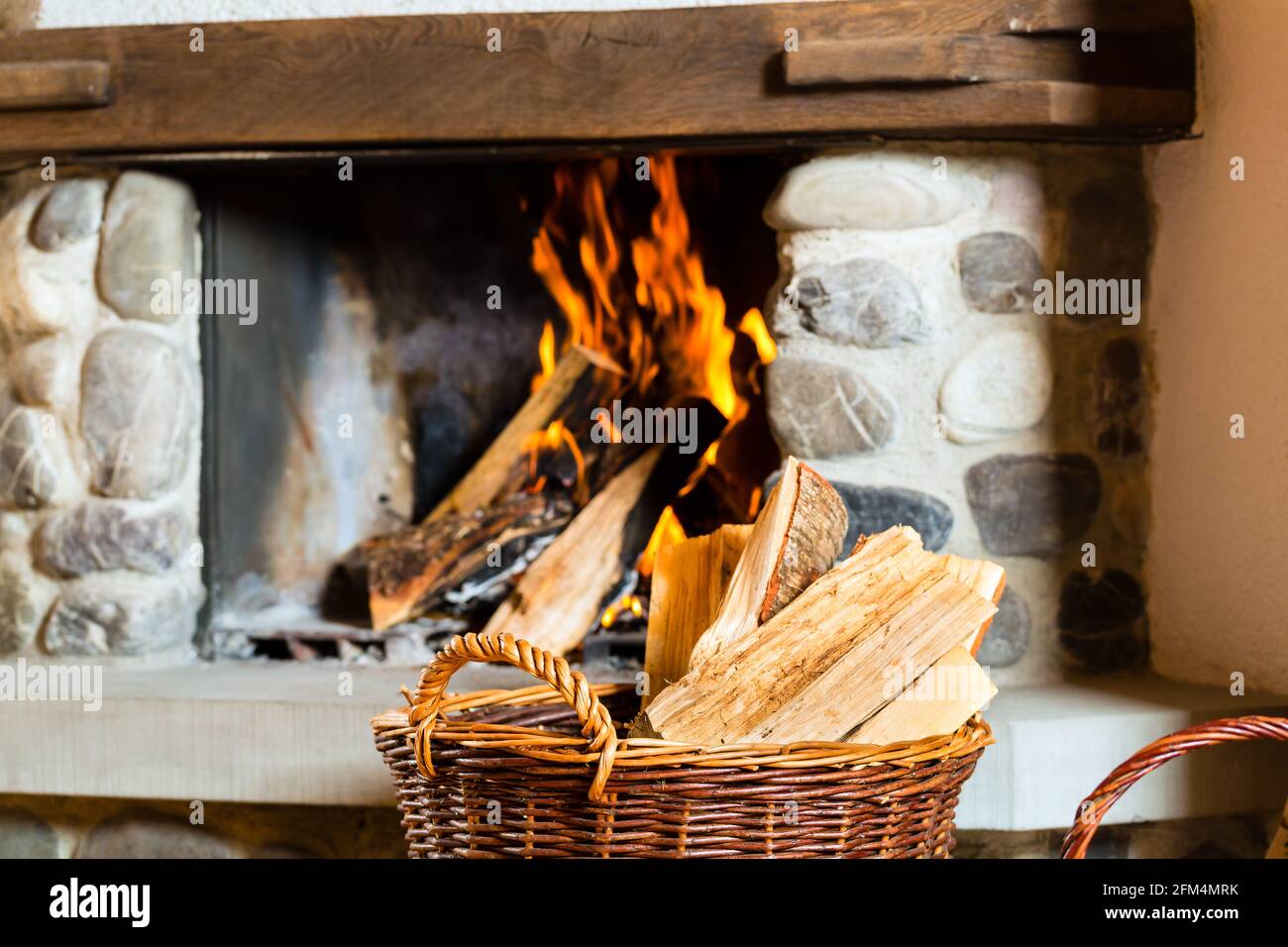 fire in a rustic fireplace in a traditional mountain hut Stock Photo ...