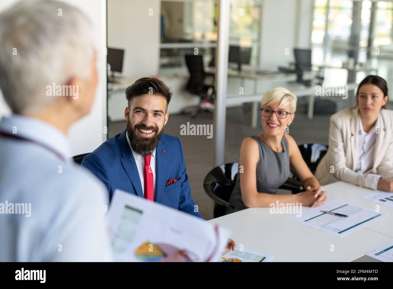 Business colleagues in conference meeting room during presentation ...