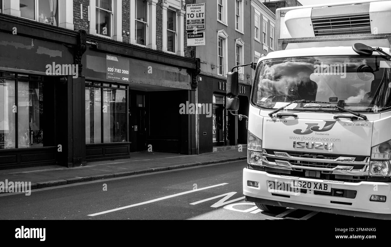 Buildings in street opposite Black and White Stock Photos & Images - Alamy