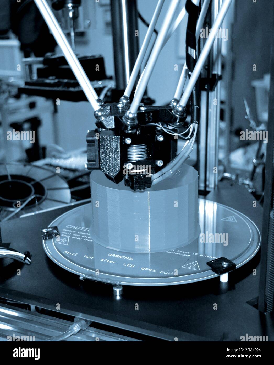 Modern 3D printer printing figure close-up. Automatic three dimensional ...