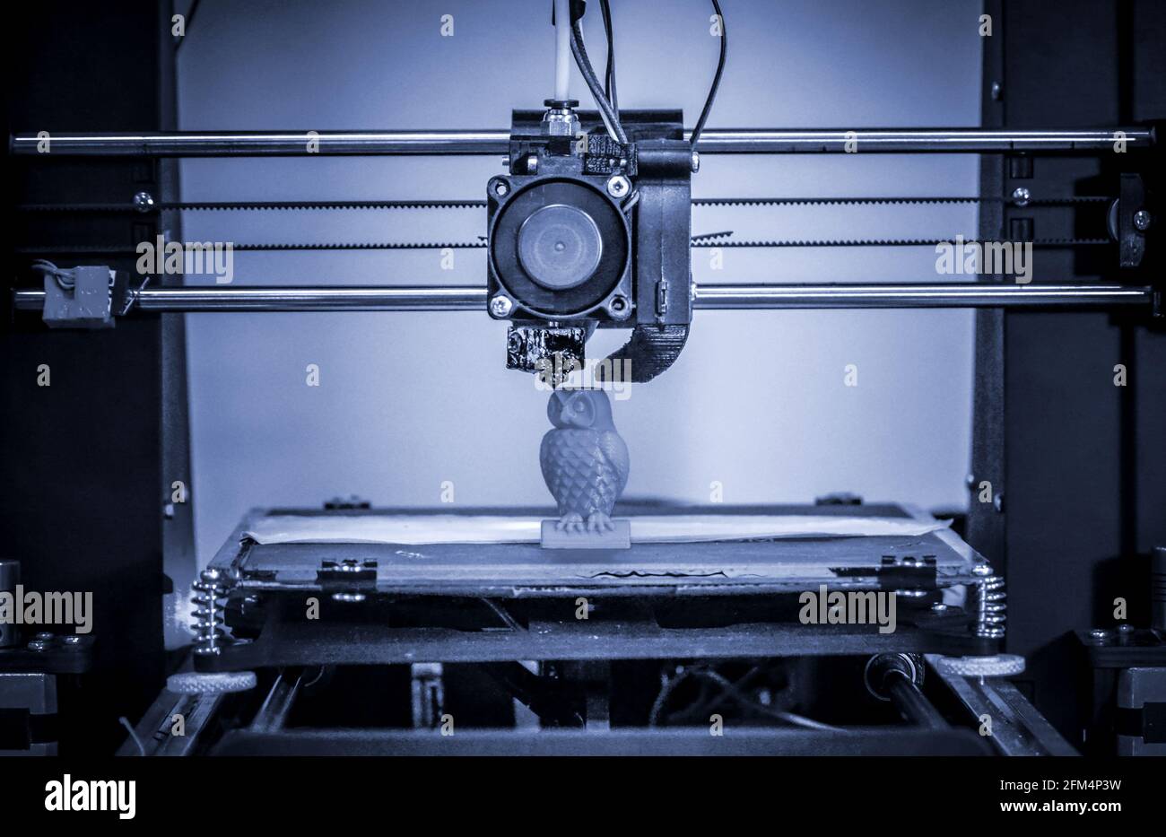 Modern 3D printer printing figure close-up. Copy space Stock Photo - Alamy