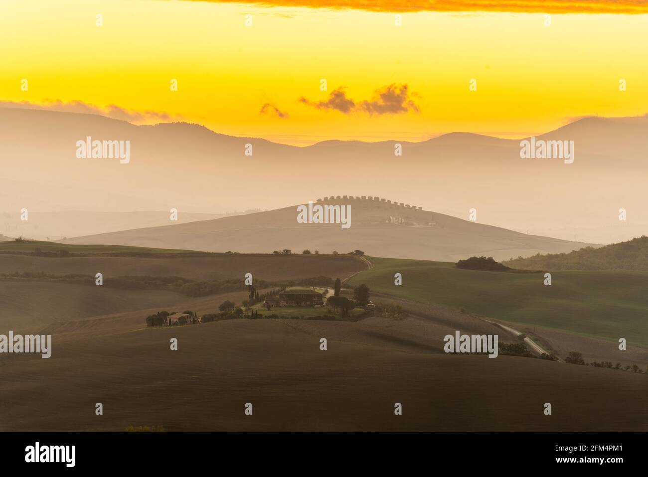 Fabulous Tuscan landscape with hills and valleys in golden morning ...